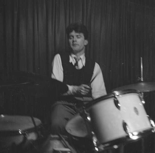 Photograph showing an unidentified jazz musician, performing on drums ...