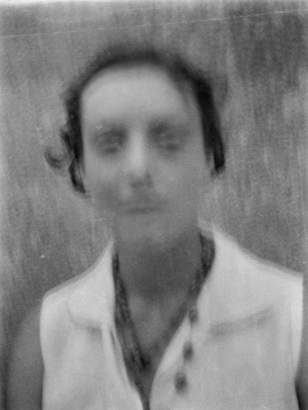 Black and white negative of Elizabeth Watson in close up, in front of a ...