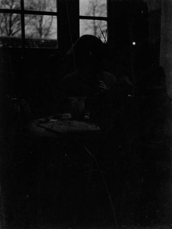Black and white negative of Elizabeth Wellesley seated on a table at ...