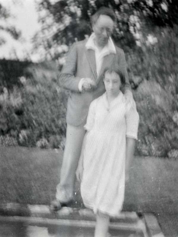 Black and white negative of Angelica Bell standing with one foot in the ...