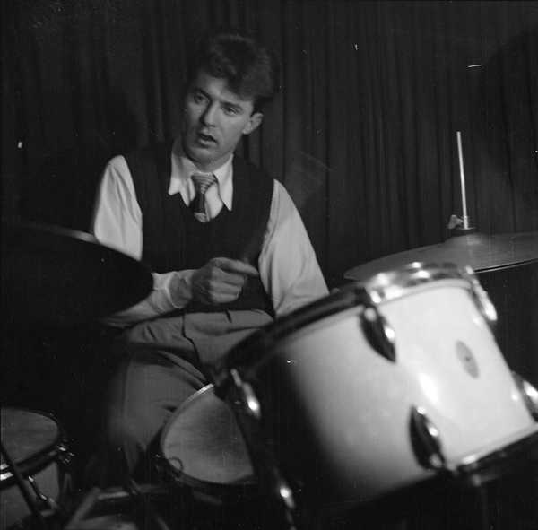 Photograph showing unidentified jazz musician, performing on drums ...