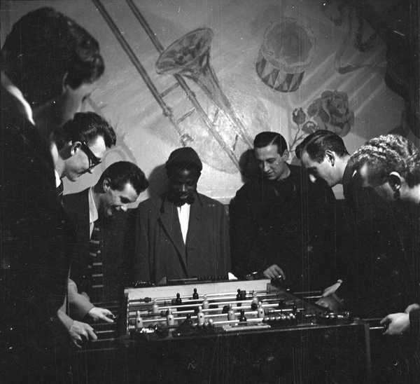 Photograph of jazz musicians playing table football, including Tony ...