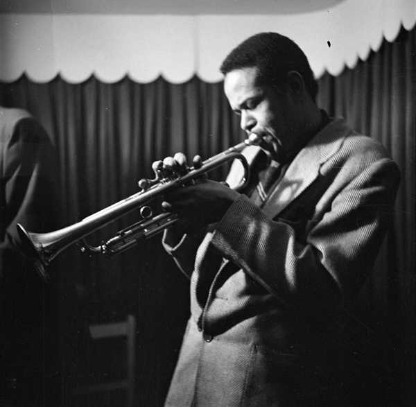 Photograph of musician performing on a trumpet, possibly Dizzy Reece ...
