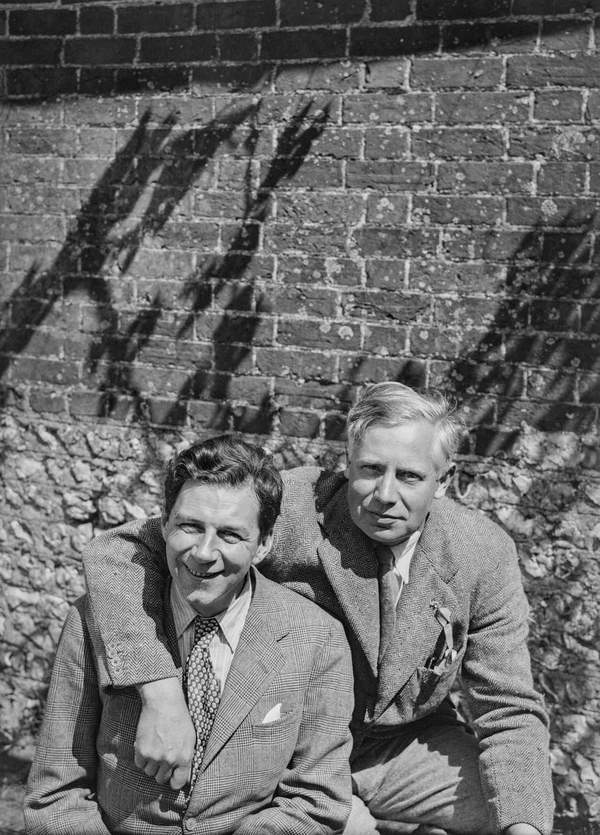Black and white negative of David Garnett with his left arm around ...
