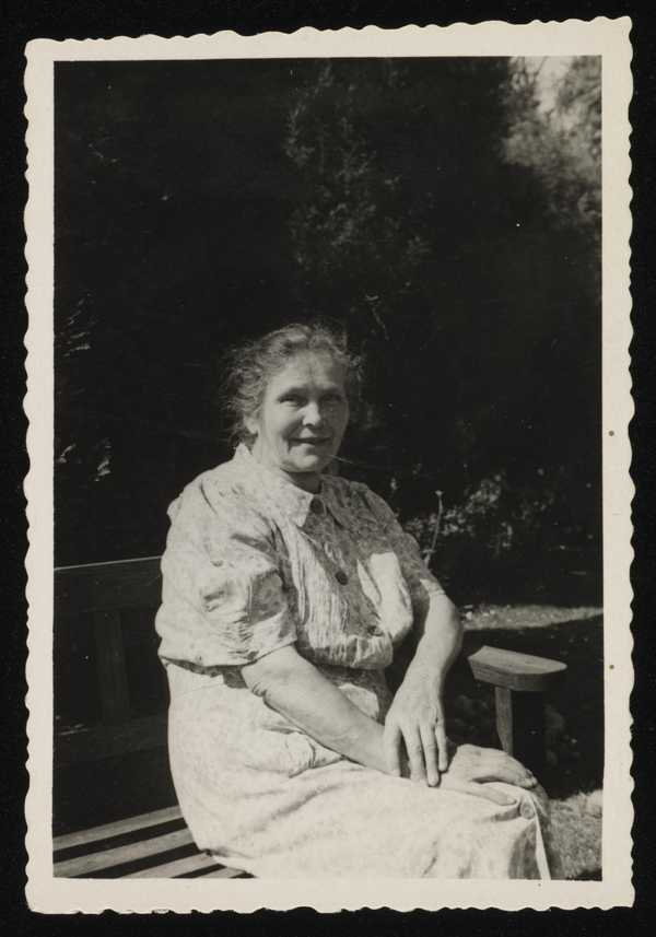 Photograph of Marie Hauptmann sitting on a bench in the garden at ...