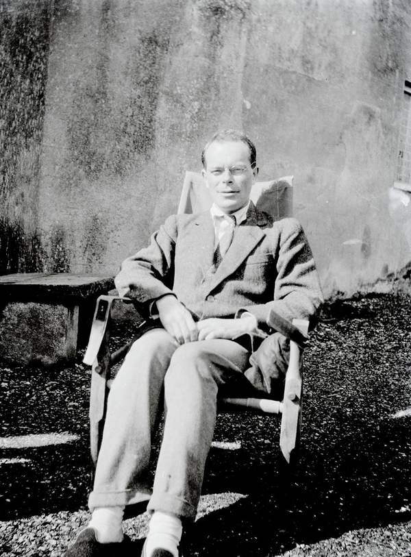 Black and white negative of Francis Birrell seated outdoors at ...