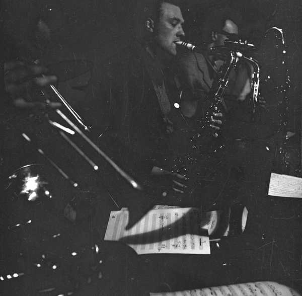 Photograph of unidentified jazz musicians, performing on saxophones ...