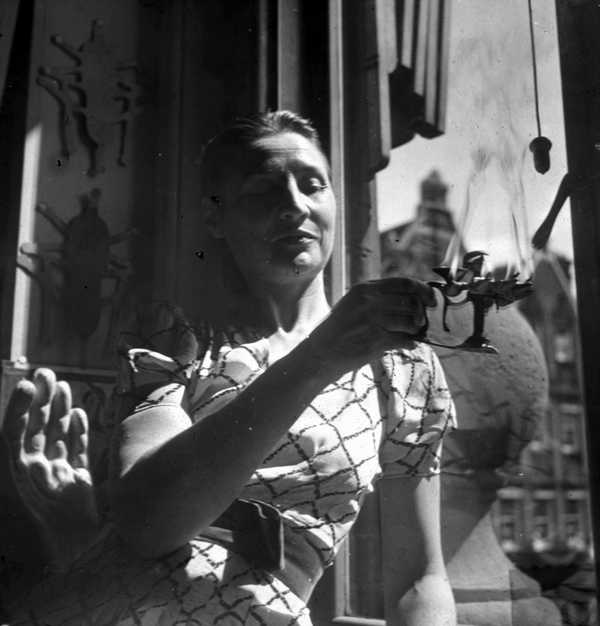 Black and white glass lantern slide of Valentine Penrose holding an oil ...