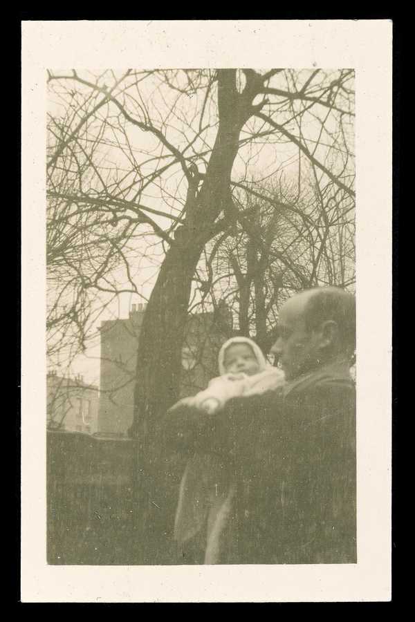 Photographs of Ben Nicholson holding one of his triplets in Hampstead ...