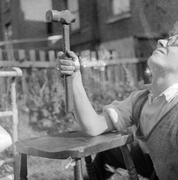 Photograph of an unidentified man holding a hammer‘, Nigel Henderson ...