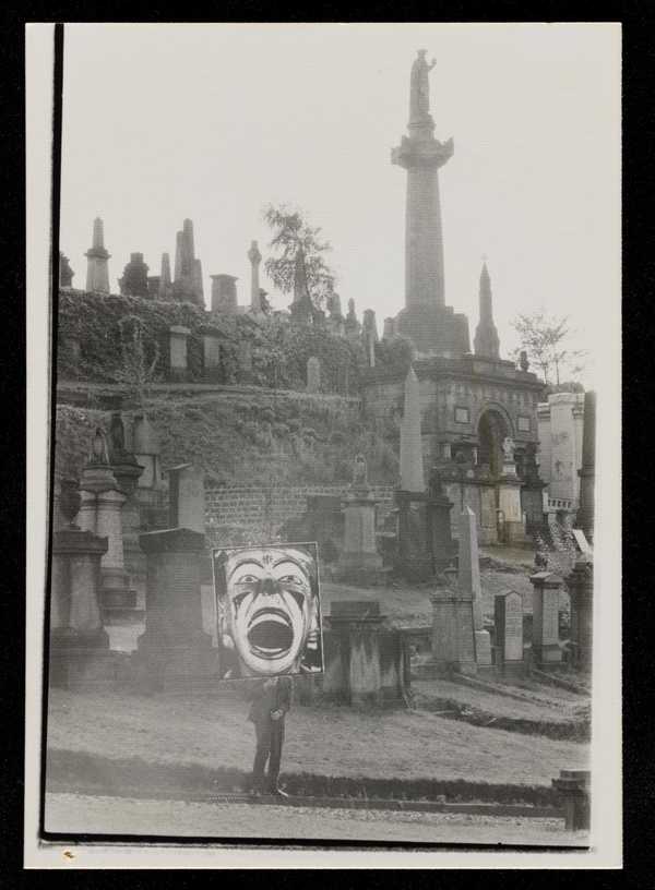 Black and white photograph of Dougie Thomson holding a large clown ...