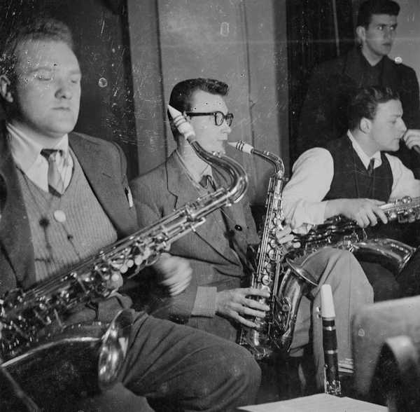 Photograph of jazz musicians at a rehearsal including Pete King, Derek ...