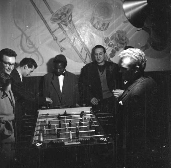 Photograph of jazz musicians playing table football, including Tony ...