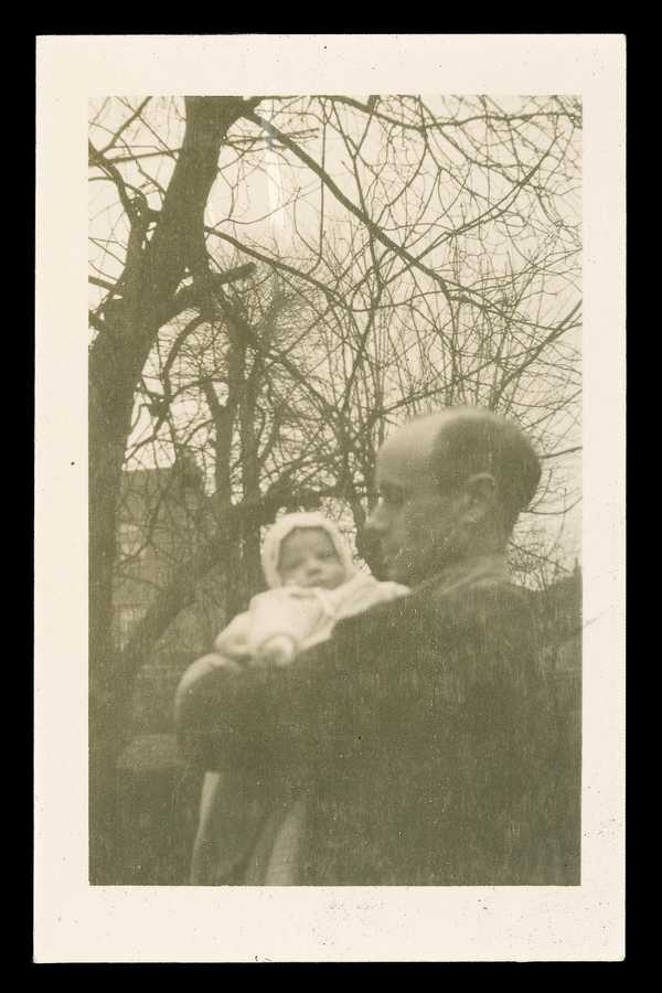 Photographs of Ben Nicholson holding one of his triplets in Hampstead ...
