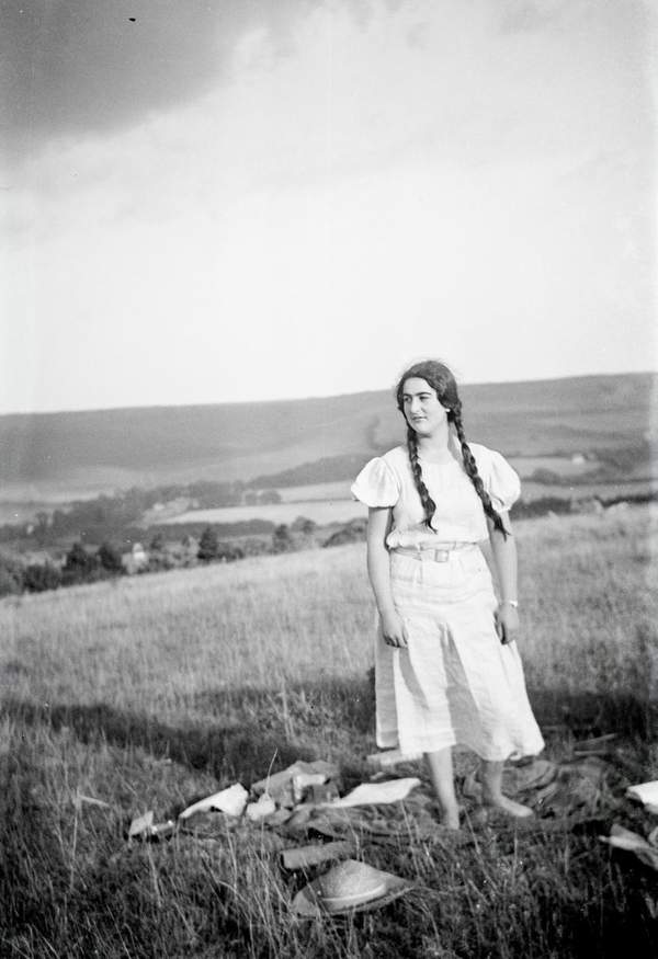 Black and white negative of an unidentified female [Anne] with braids ...