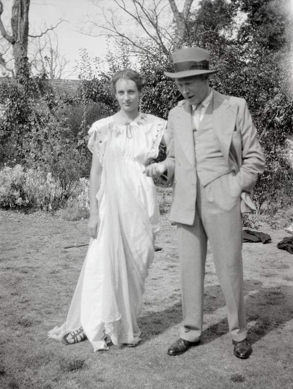Black and white negative of Angelica and Clive Bell standing next to ...