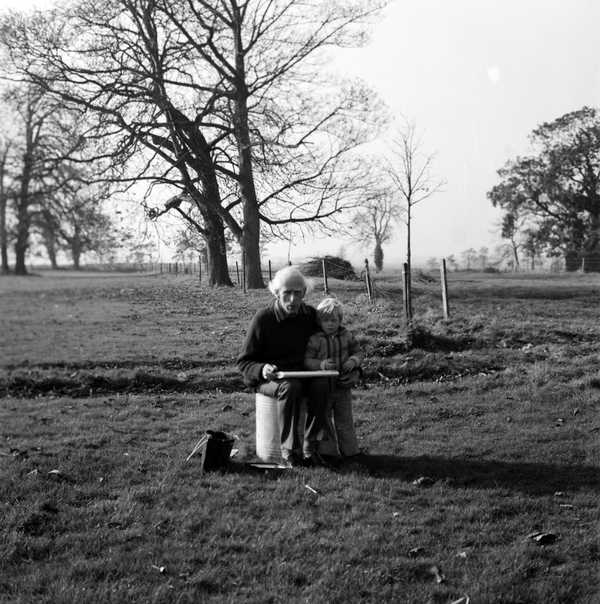 Photograph of John Piper and a child with a sketchbook at Thorpe Tilney ...