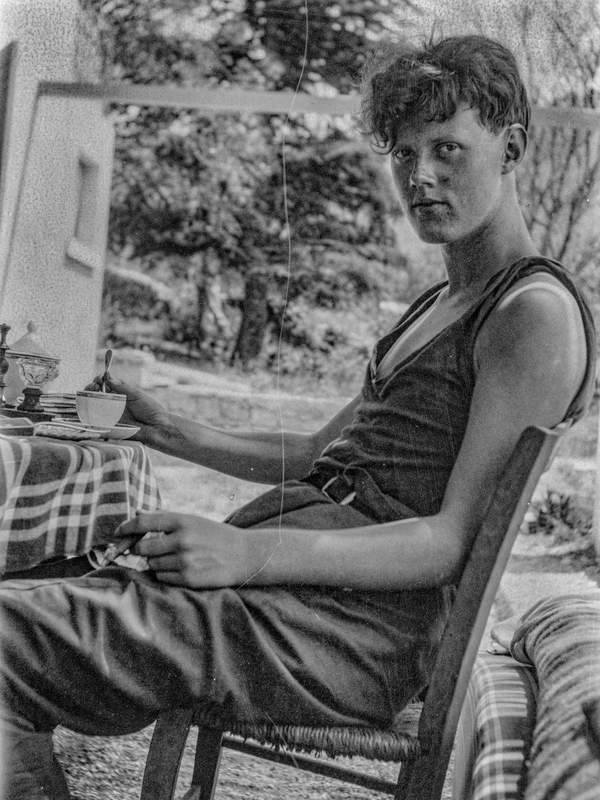 Black and white negative of Quentin Bell wearing a vest, seated at the ...