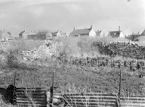 Photograph of houses in the background near Easton, Isle of Portland ...