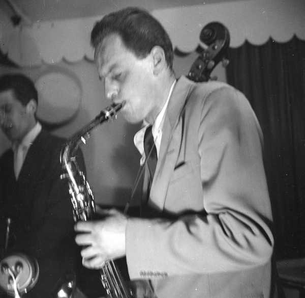 Photograph showing unidentified jazz musician, performing on saxophone ...