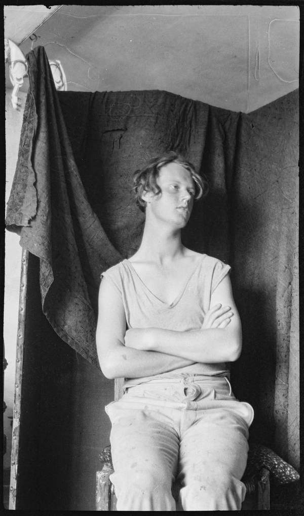 Black and white negative of Quentin Bell wearing a vest, seated with ...