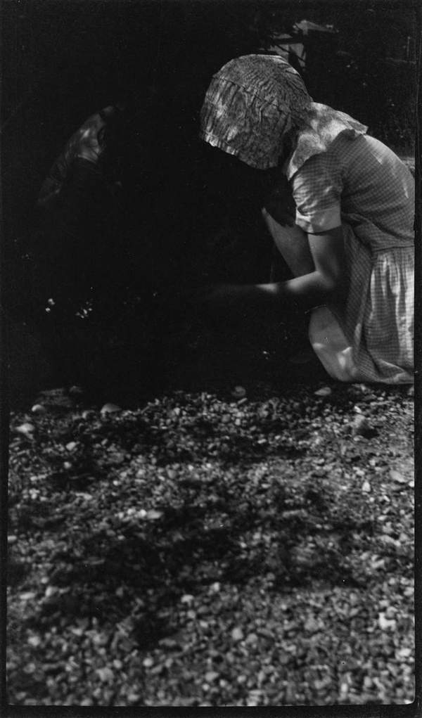 Black and white negative of Eve Younger in profile with an unidentified ...