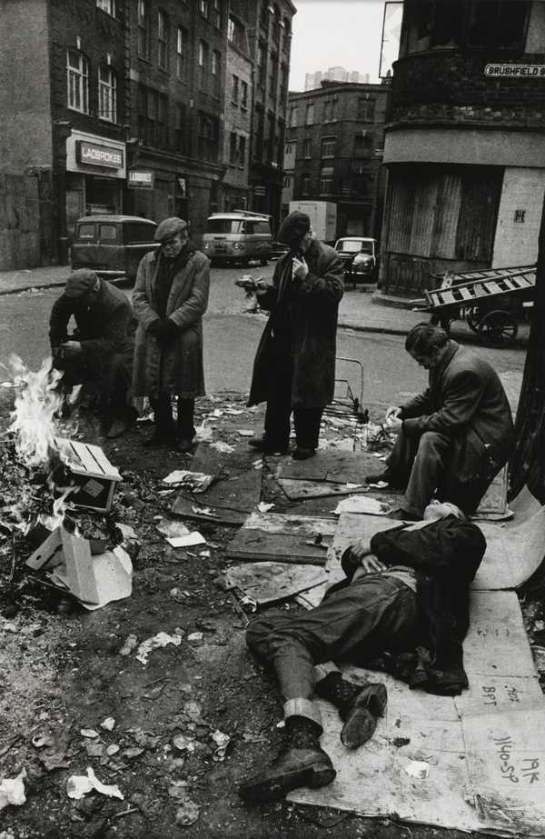 ‘Homeless men gather around a makeshift fire, Spitalfields Market ...