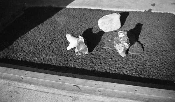 Black and white negative, still life, flints in shadow on a table ...