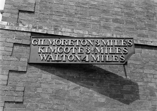 Photograph of a signpost possibly located in Lutterworth ...