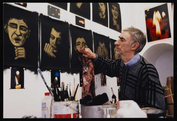 Colour photograph of Ian Breakwell working on his series of paintings ...