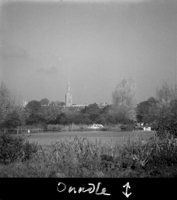 Photograph of a countryside landscape with St Peter’s Church spire in ...