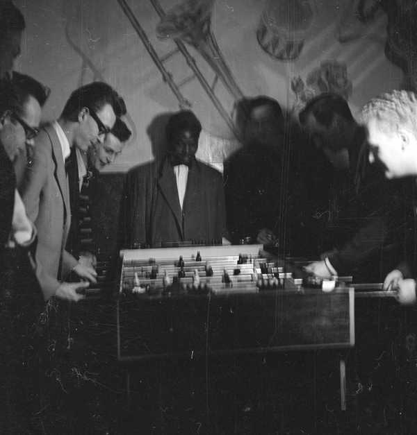 Photograph of jazz musicians playing table football, including Tony ...