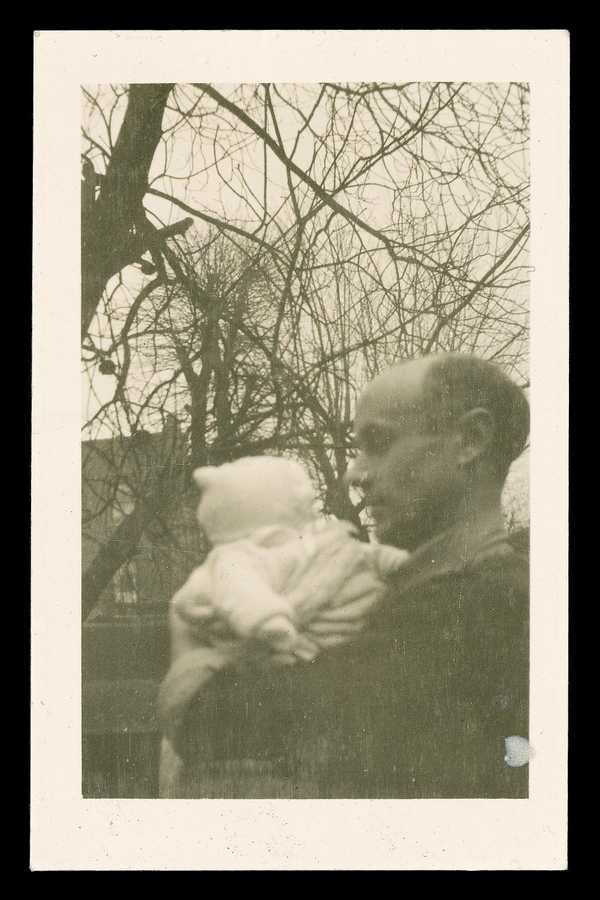 Photographs of Ben Nicholson holding one of his triplets in Hampstead ...