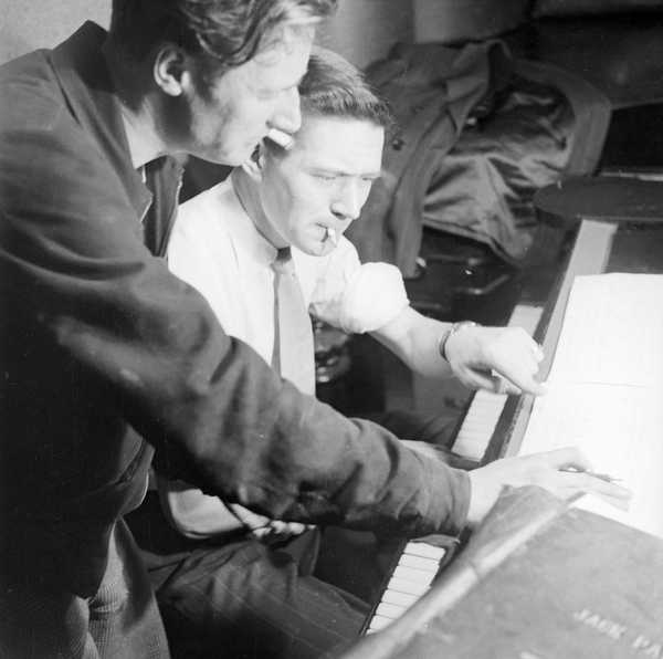 Photograph of Jack Parnell performing on piano with an unidentified man ...