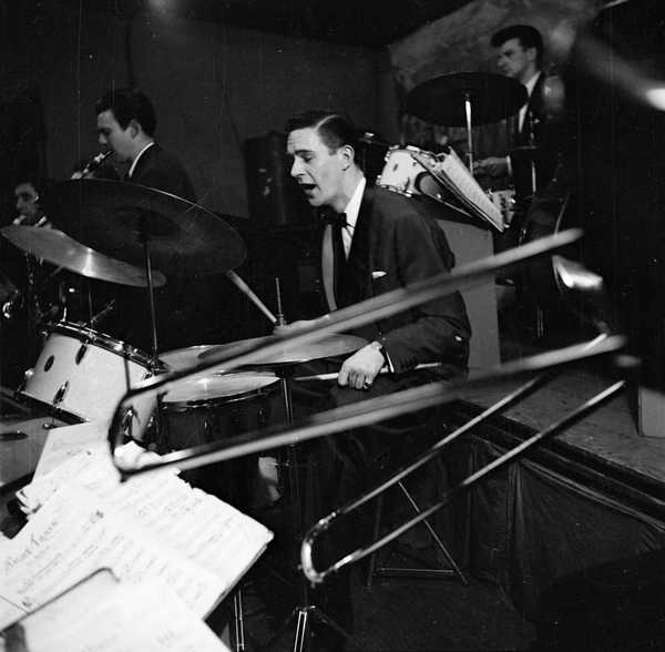 Photograph of Jack Parnell performing on drums on stage with band ...