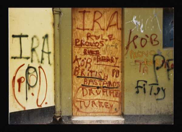 Colour photograph of a wall and doorway in Northern Ireland painted ...