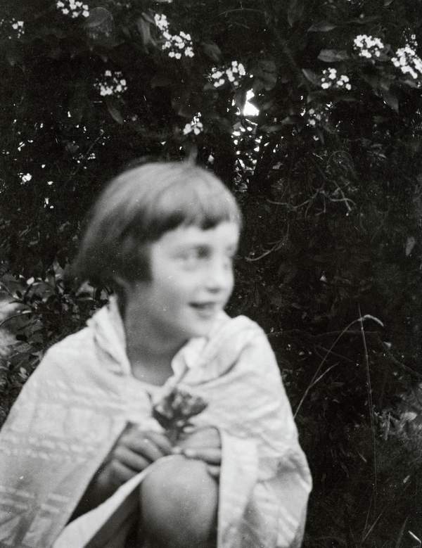 Black and white negative of Angelica Bell in close up, wearing a cape ...