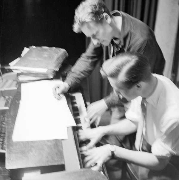 Photograph of Jack Parnell performing on piano with an unidentified man ...