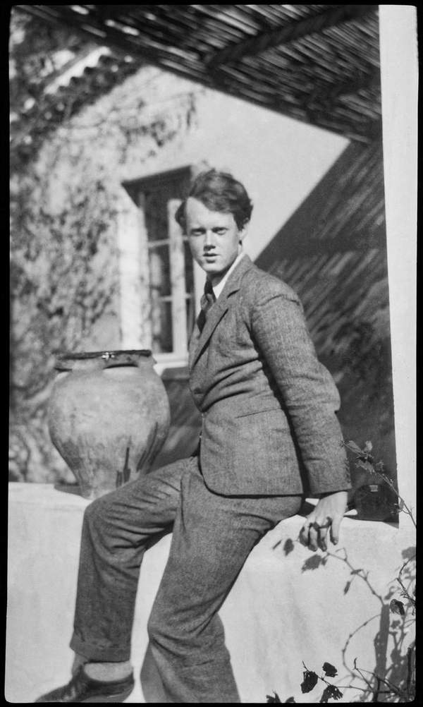 Black and white negative of Quentin Bell wearing a suit, seated on a ...