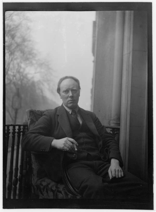 Black and white negative of Clive Bell seated on the balcony at 46 ...