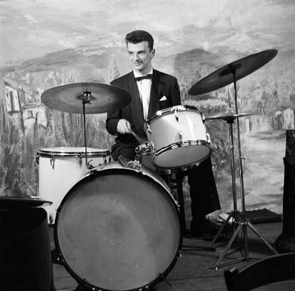 Photograph showing an unidentified jazz musician, performing on drums ...