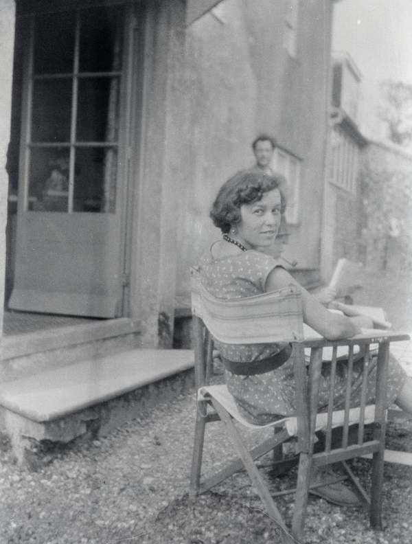 Black and white negative of Frances Marshall looking over her shouldner ...
