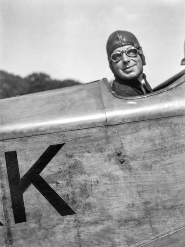 Black and white negative of David Garnett in his aeroplane in [Sussex ...