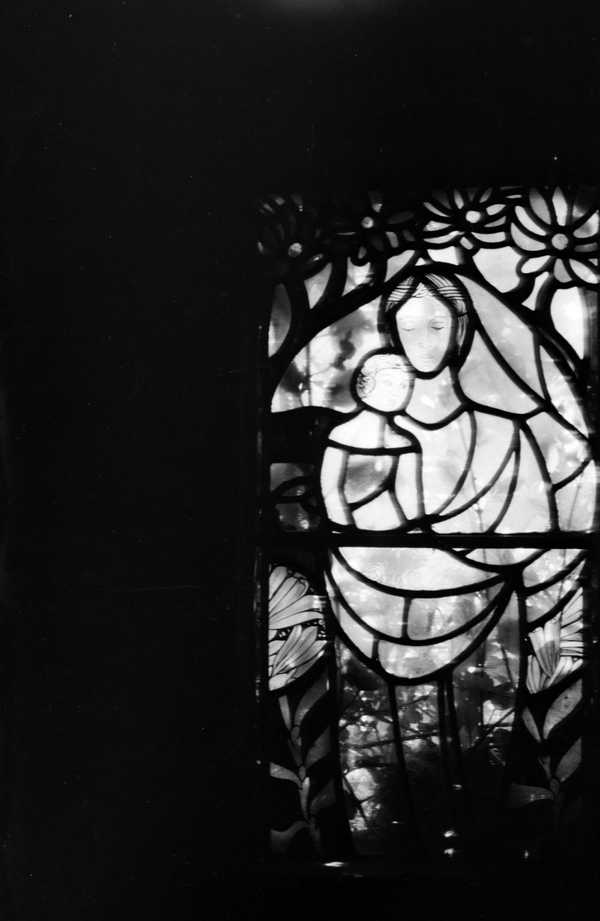 Photograph of a stained glass window in the chapel at the White Lodge ...
