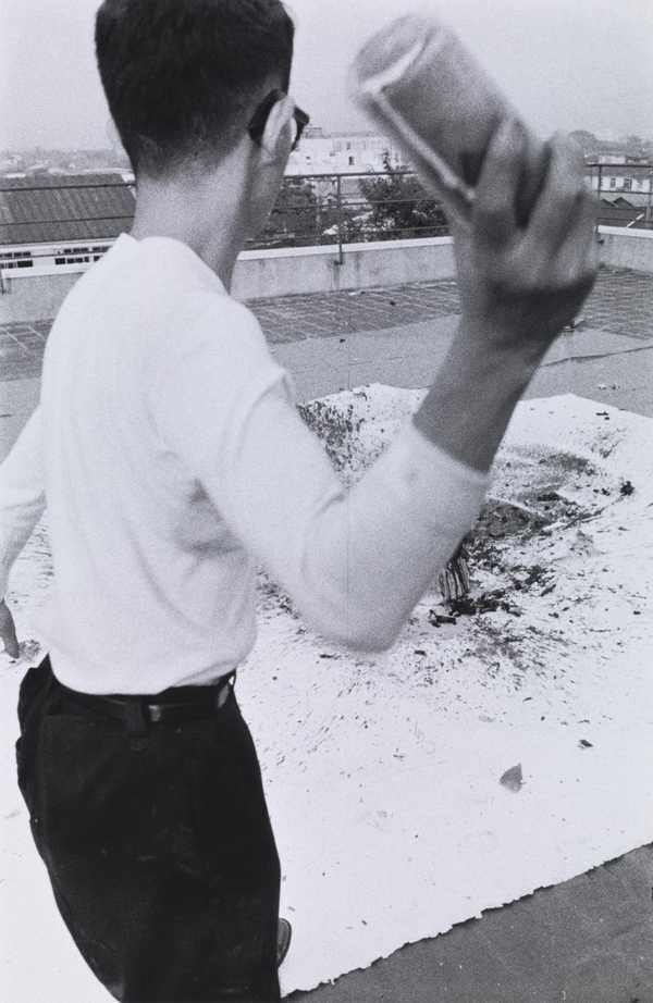 ‘Shimamoto Shozo making a painting by hurling glass bottles of paint ...